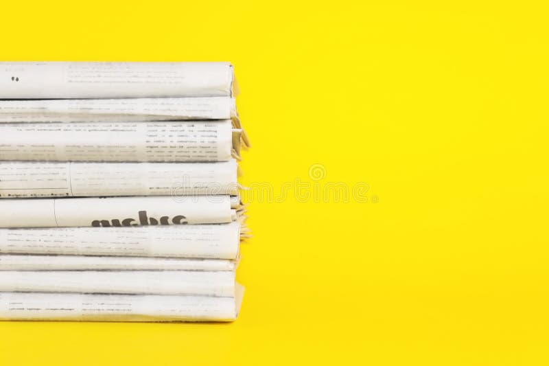 Stack of Newspapers in Different Languages on Yellow Background, Space ...