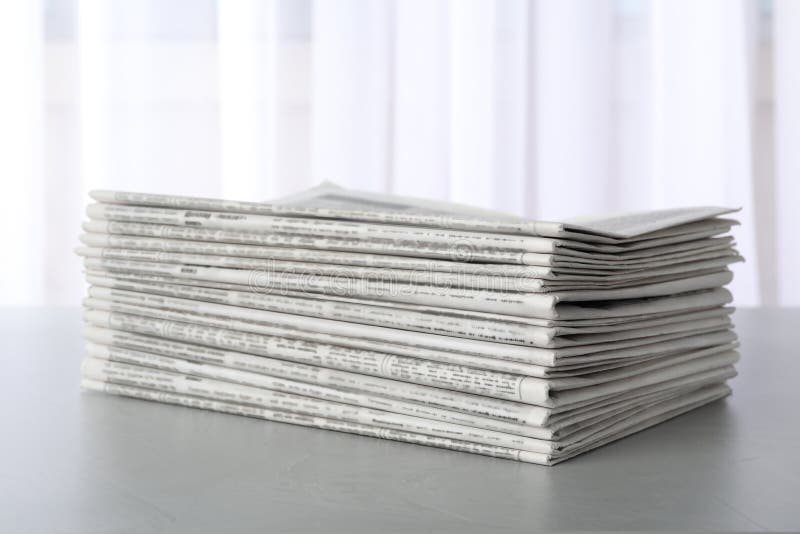 Stack of Newspapers on Grey Table. Journalist`s Work Stock Photo ...