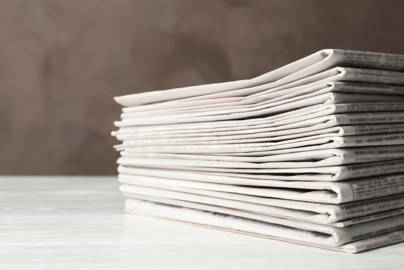 Stack of Newspapers on White Table. Journalist`s Work Stock Image ...