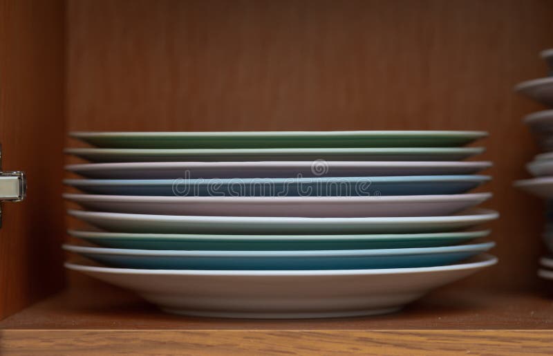 Stack of Nine Plates in Multiple Colors.. Stock Image - Image of fried ...