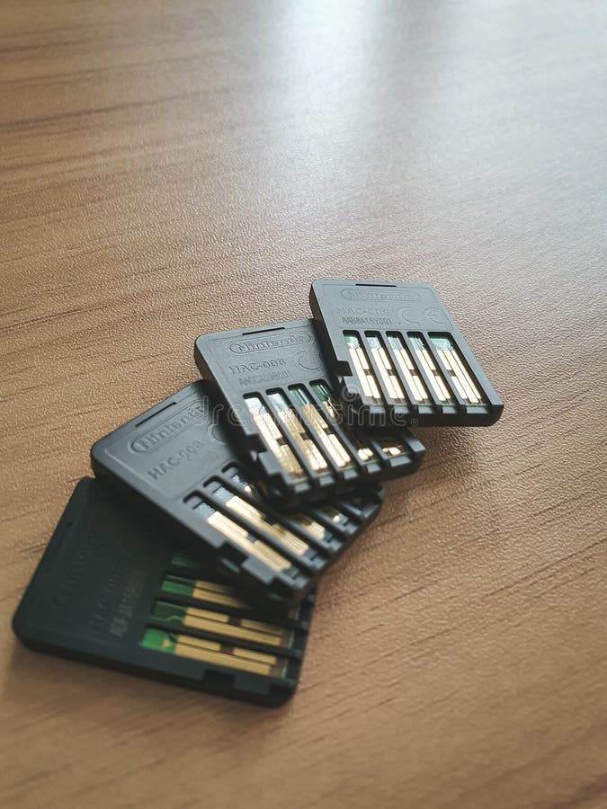 Stack of Nintendo Switch Cartridge on a Wooden Table. Selective Focus ...