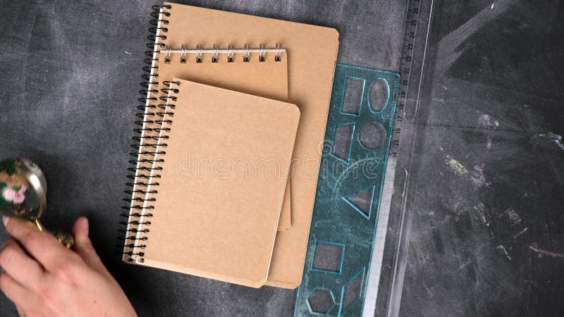 Stack of Notebooks with Blank Sheets, Ruler and Glass Globe on Black ...