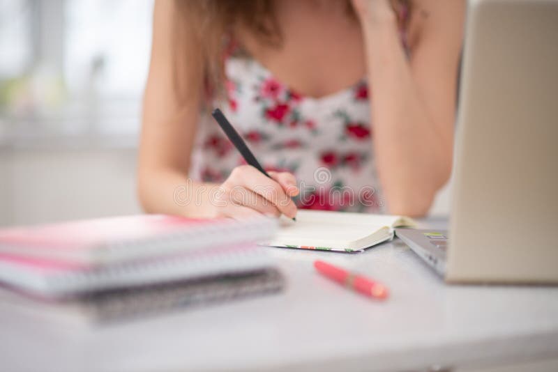 A Stack of Notebooks on the Spiral and Girl Student at the Laptop Stock ...