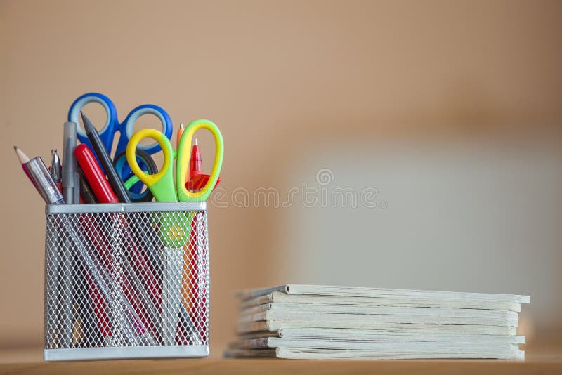Stack of Notebooks and Stationery Arrangement in Classroom or Office on ...