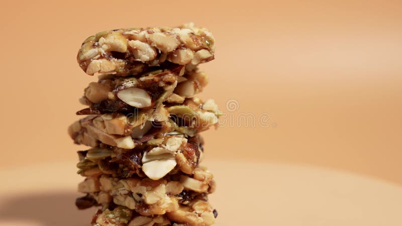 A Stack of Nuts and Seeds Rotates Against an Orange Background. Nuts of ...