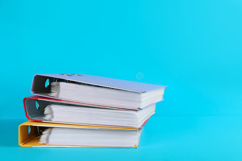 Stack of Office Folders on Light Blue Background, Space for Text Stock ...