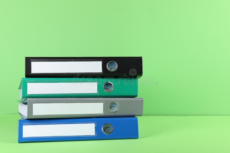 Stack of Office Folders on Light Green Background, Space for Text Stock ...