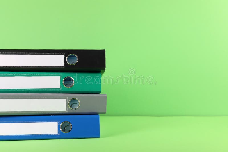 Stack of Office Folders on Light Green Background, Space for Text Stock ...