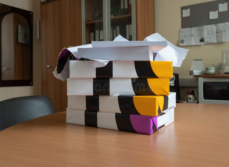 A Stack of Office Papers for the Printer Lies on the Table in the ...