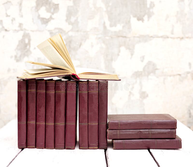 Stack of Old Ancient Shabby Books on a White Wooden Background Stock ...