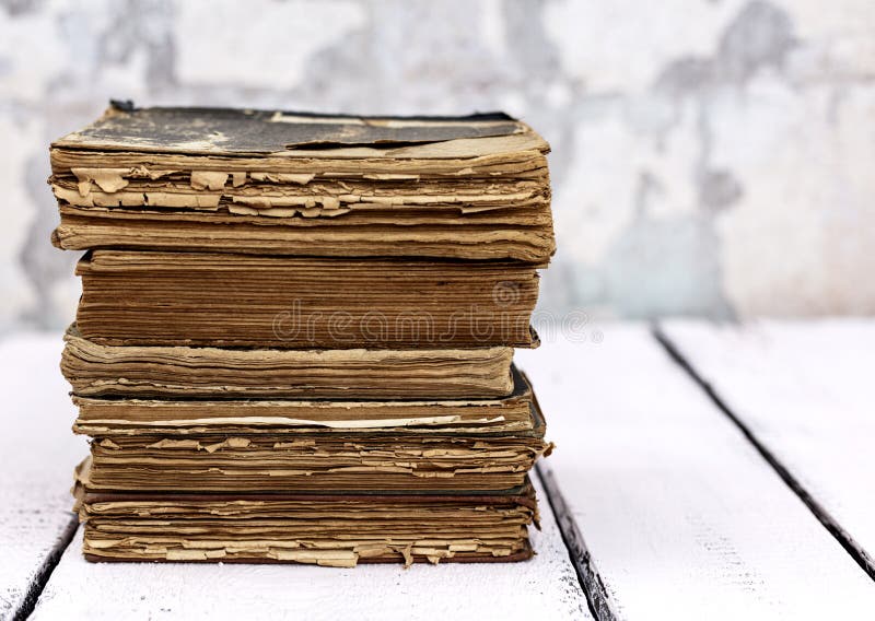 Stack of Old Ancient Shabby Books on a White Wooden Background Stock ...