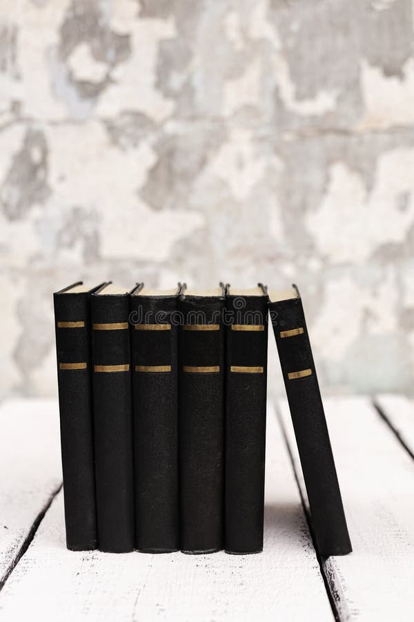 Stack of Old Ancient Shabby Books on a White Wooden Background Stock ...
