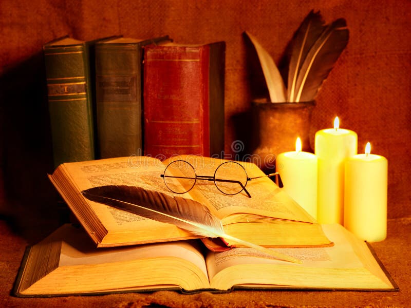 Stack old book and candle. stock photo. Image of flame - 20566604