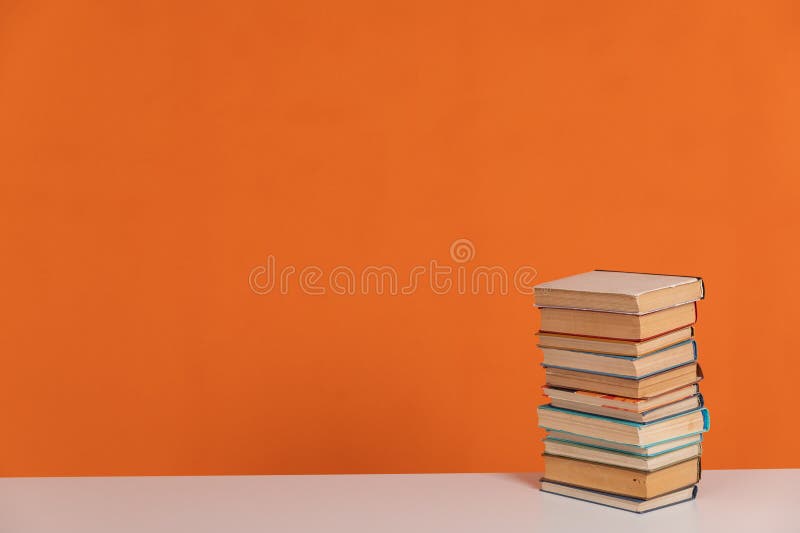 Stack of Old Books for College Library on Orange Background Stock Photo ...