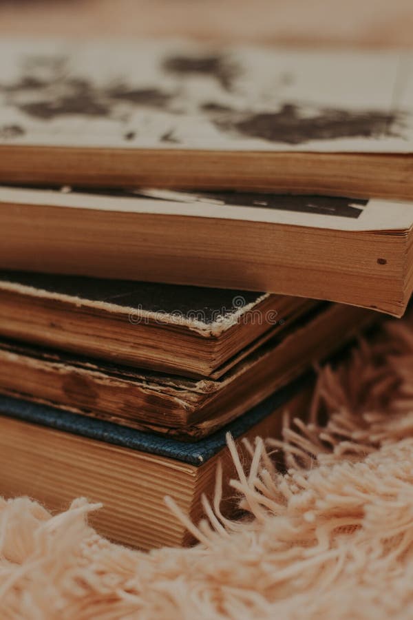 A Stack of Old Books on a Cozy Fluffy Beige Blanket. Place for Text ...
