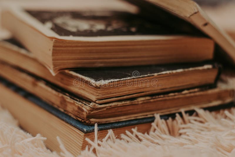 A Stack of Old Books on a Cozy Fluffy Beige Blanket. Place for Text ...