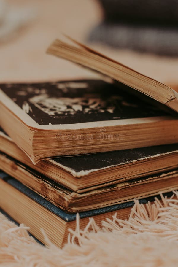 A Stack of Old Books on a Cozy Fluffy Beige Blanket. Place for Text ...