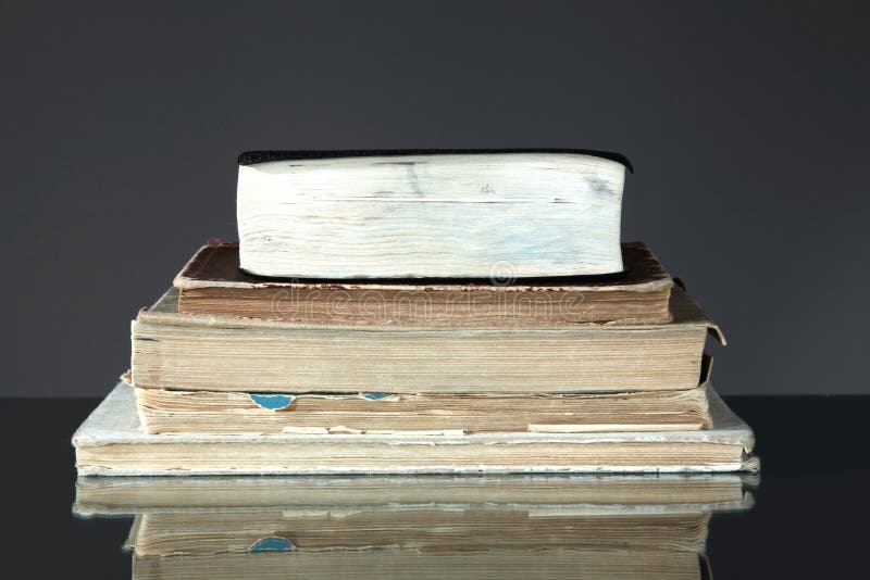 Stack of old books on dark stock image. Image of background - 29657779