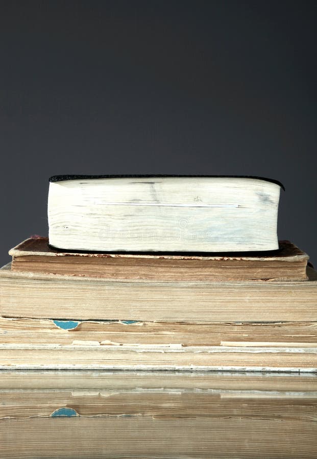 Stack of old books on dark stock image. Image of literature - 29657827