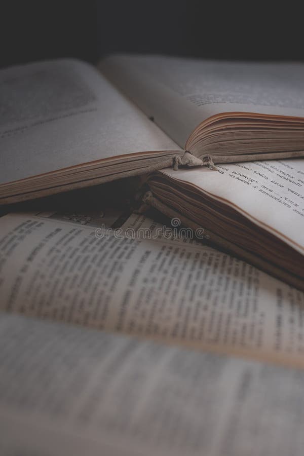 A Stack of Old Books with Frayed Spines and Yellowed Pages Stock Image ...