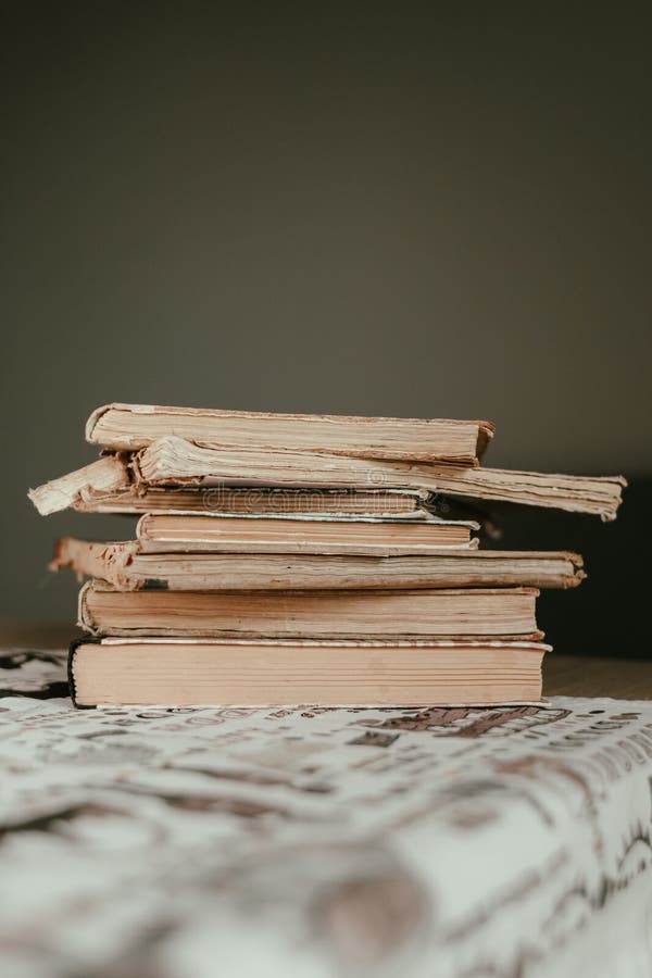A Stack of Old Books with Frayed Spines and Yellowed Pages Stock Photo ...