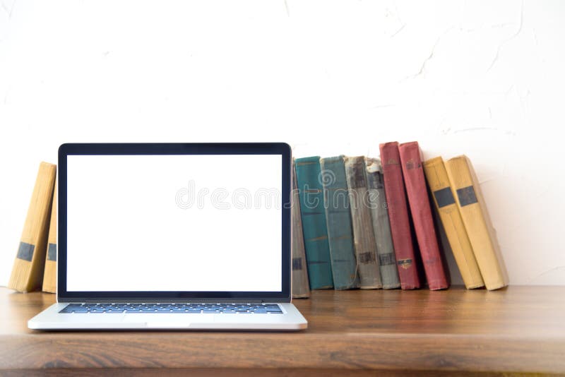 Stack of Old Books and Laptop Over Wooden Table, Retro Filtered Image ...