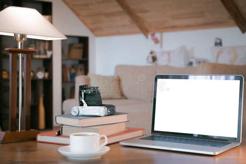 Stack of Old Books, Open Laptop and Old Camera Over Wooden Table, Retro ...