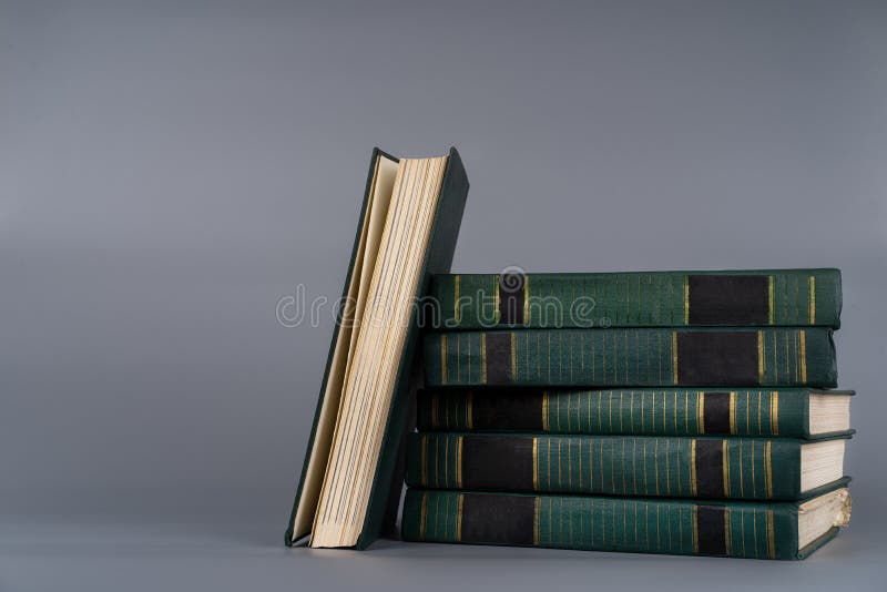 A Stack of Old Books on a Plain Background Stock Photo - Image of ...
