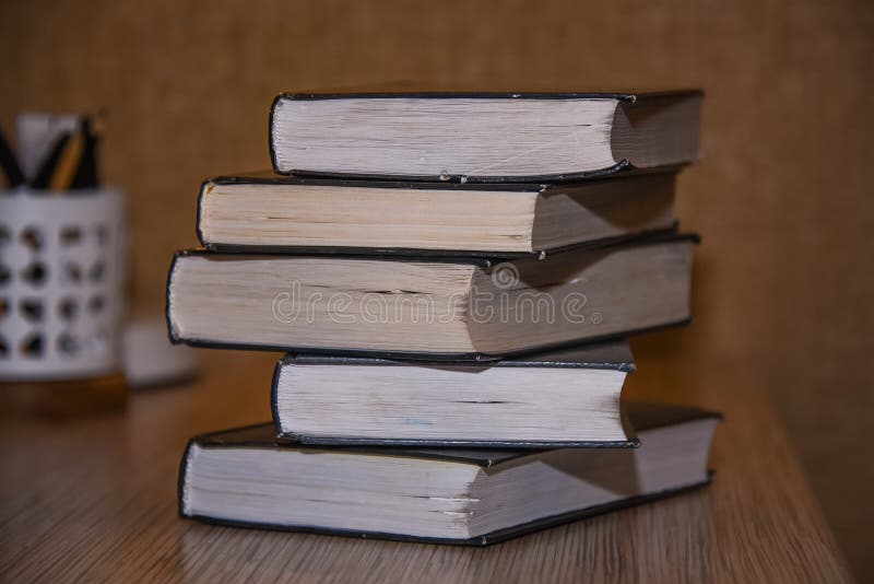 Stack of Old Books on the Table Side View Stock Photo - Image of used ...