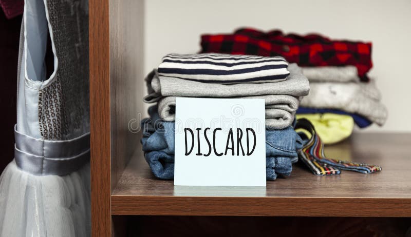 Stack of Old Clothes To Discard Declutter or Donate. Recycling Fabric ...