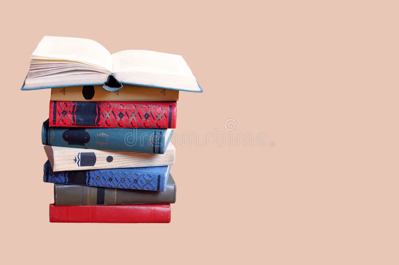 Stack of Old Color Books, Isolated on Beige Background. Stock Photo ...
