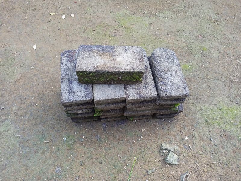 Stack of Old Concrete Paving Stones on Dirt Stock Photo - Image of ...