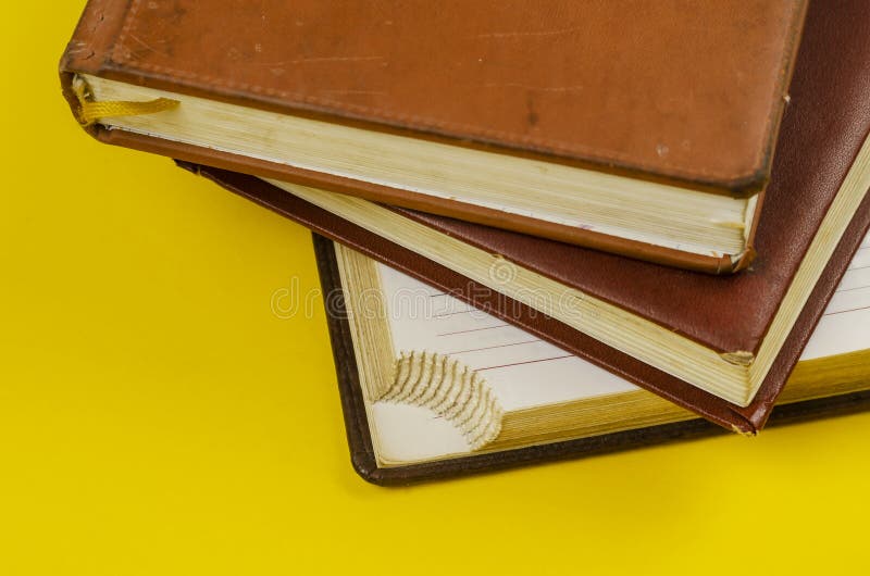 Stack of Old Diaries Lying on Yellow Background Stock Image - Image of ...