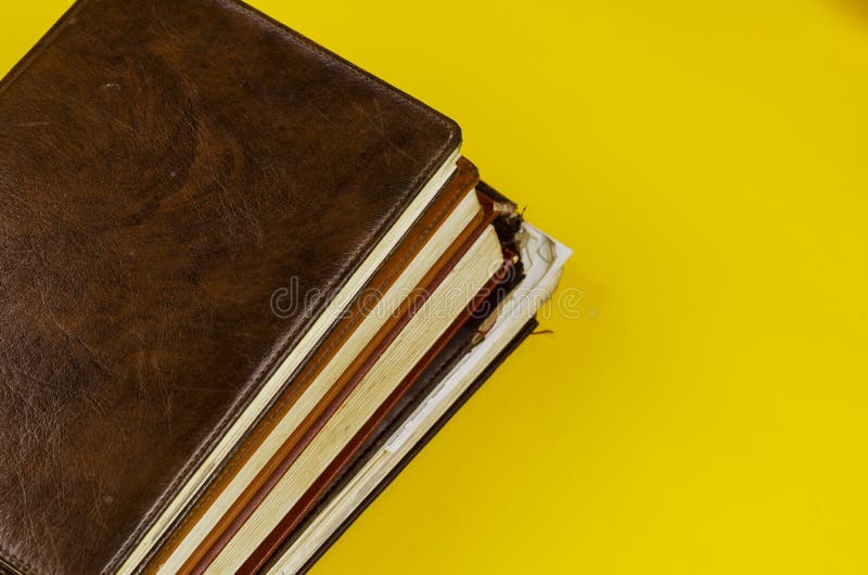 Stack of Old Diaries Lying on Yellow Background Stock Image - Image of ...