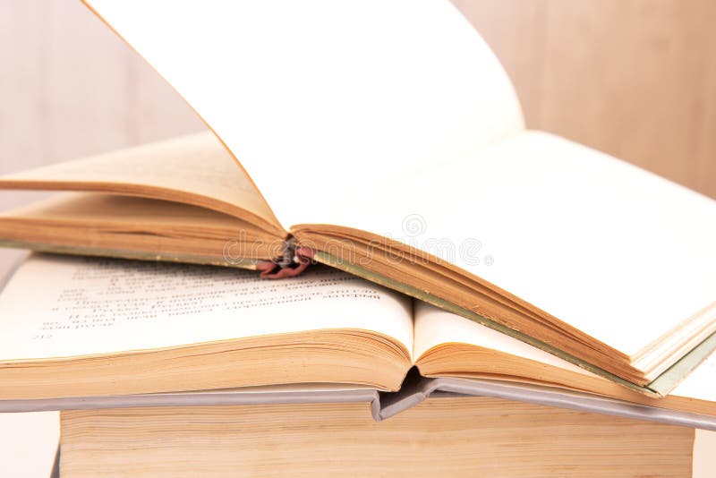 Stack of Old Hardback Books and Open Book. Many Books Piles. Hardback ...