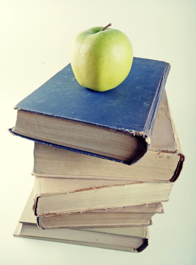 Stack of Old Hardcover Books with Green Apple Stock Image - Image of ...