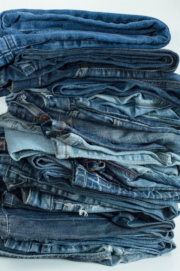 Stack of a Stack of Old Jeans Various Shades of Blue Jeans. Denim Jeans ...