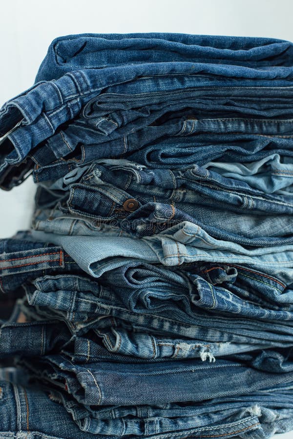 Stack of a Stack of Old Jeans Various Shades of Blue Jeans. Denim Jeans ...