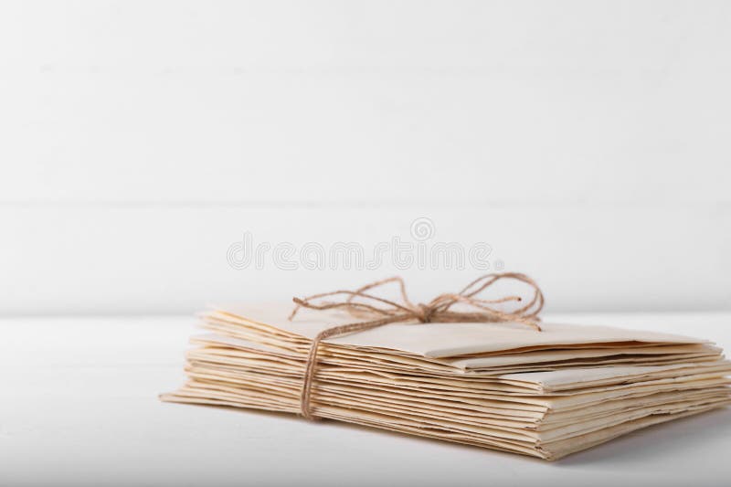 Stack of Old Letters Tied with Twine on White Wooden Table, Closeup ...