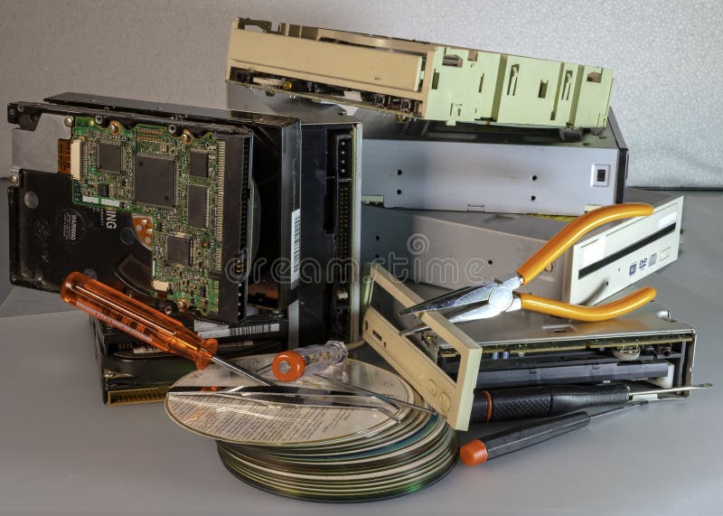 Stack of Old SATA, ATA Hard Disk Drives and Driver Cd Disassembled ...