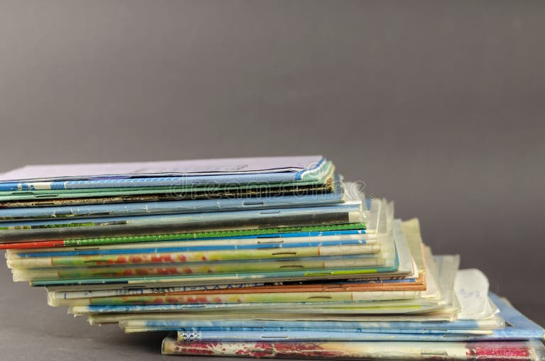 Stack of Old School Exercise Books on a Gray Background Stock Photo ...