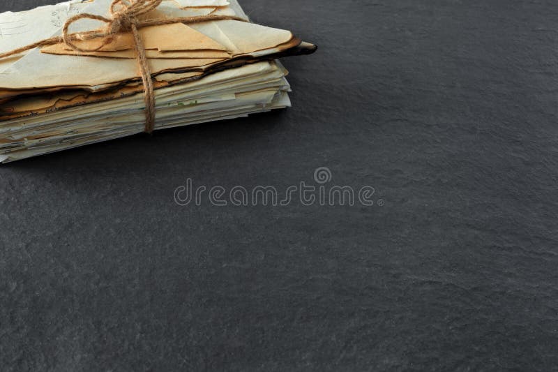 Stack of Old Torn Vintage Letters on Yellowed Paper Against Black ...
