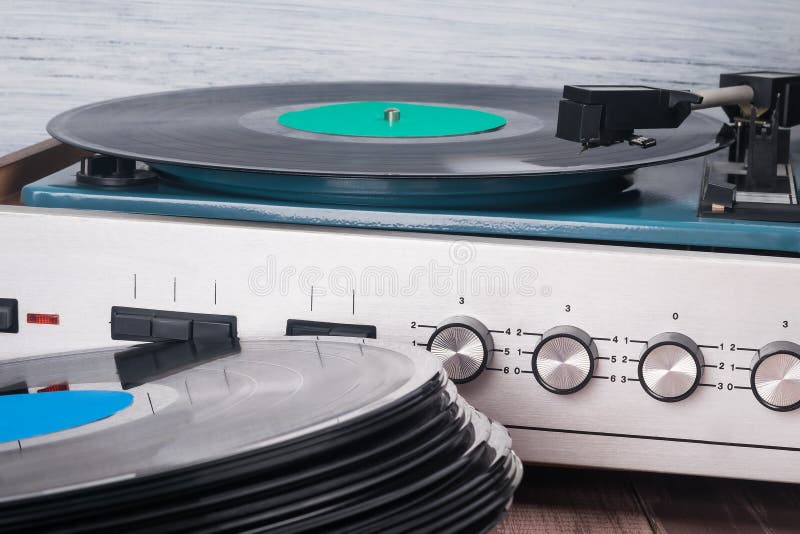 A Stack of Old Vinyl Records on the Background of a Turntable Stock ...