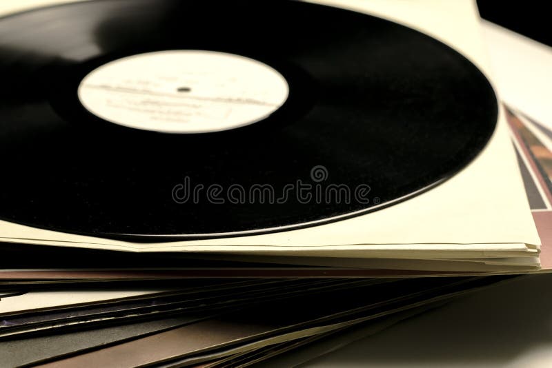 A Stack of Old Vinyl Records Close Up One of the Records is Taken Out ...
