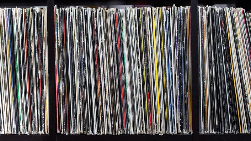 Vinyl Record with Copy Space in Front of a Collection of Albums ...