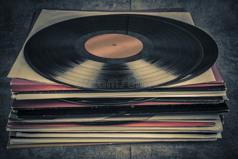 Stack of Old Vinyl Records on the Table. Retro Style Toned Image Stock ...