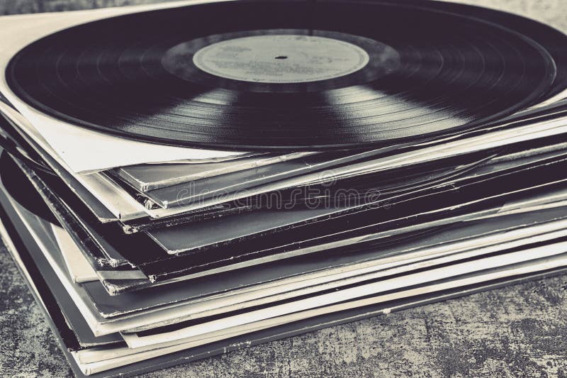Stack of Old Vinyl Records on the Table. Retro Style Toned Image Stock ...