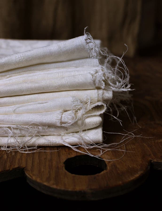 Stack of Old White Linen Fabric on Dark Wooden Table, Vintage Style ...