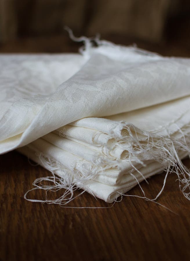 Stack of Old White Linen Fabric on Dark Wooden Table Stock Image ...