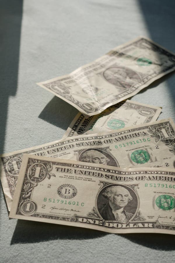 A Stack of One Dollar Bills on a Table Stock Image - Image of exchange ...
